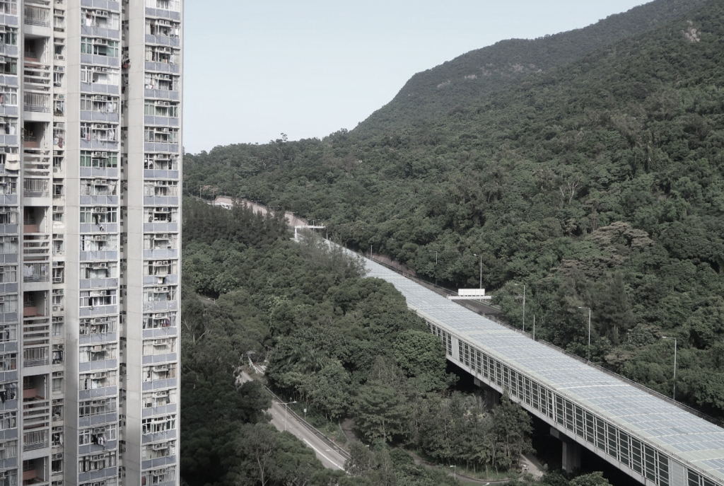 Woman sits precariously on window ledge at Heng On Estate, Ma On Shan ...