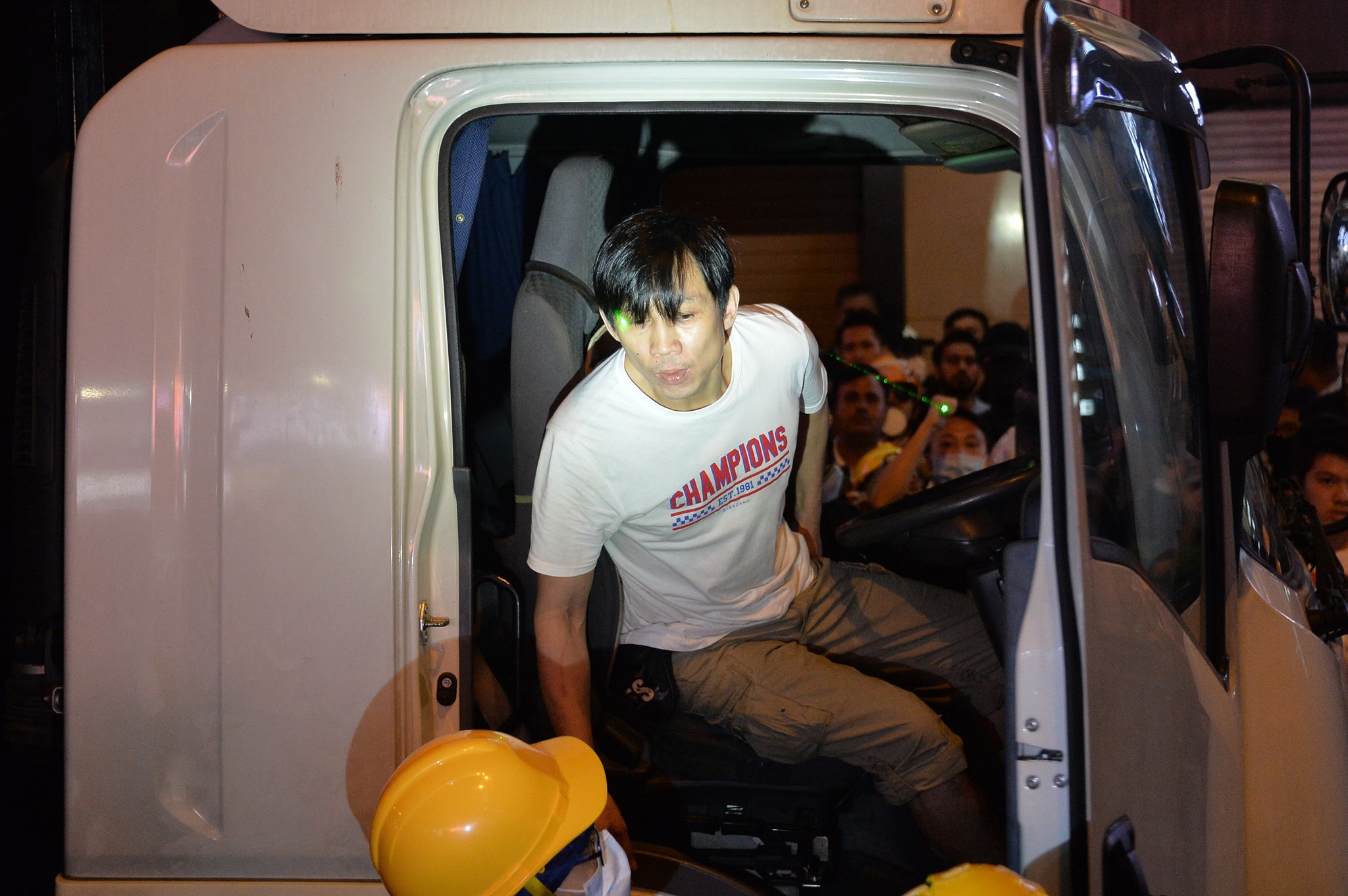 Truck driver mobbed by protesters after he allegedly tried to ram into ...