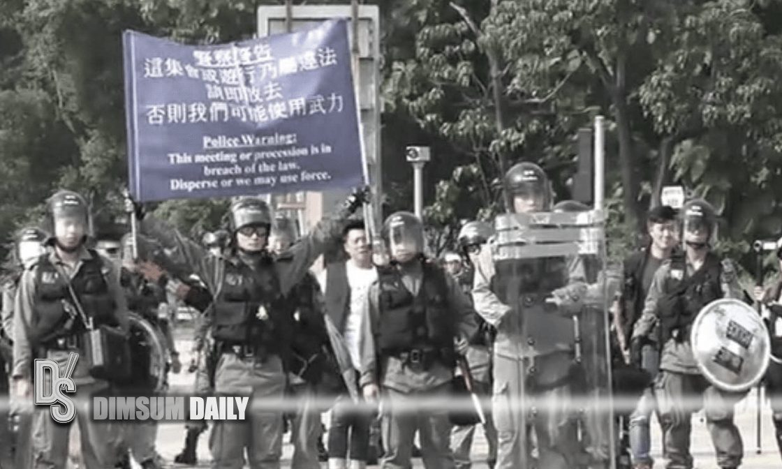 Blue flag raised for the fourth time by riot police to warn protesters ...