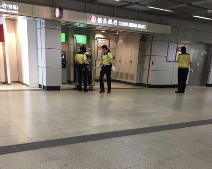 MTR staff of Tsuen Wan Station remove fire extinguishers and cover ...