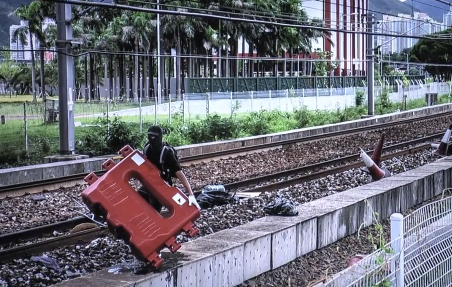 Protester hurls rocks onto Airport Express Railway track to derail ...