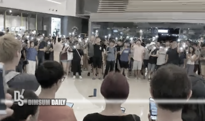 Hundreds of civilians gather at the concourse of Tai Po Mega Mall ...