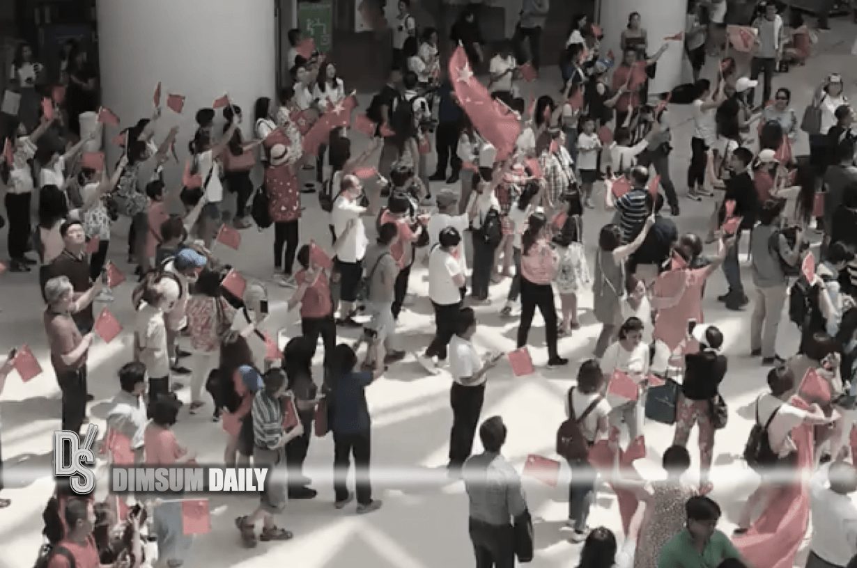 Flash mob Beijing supporters turn up at Olympian City to wave Chinese ...