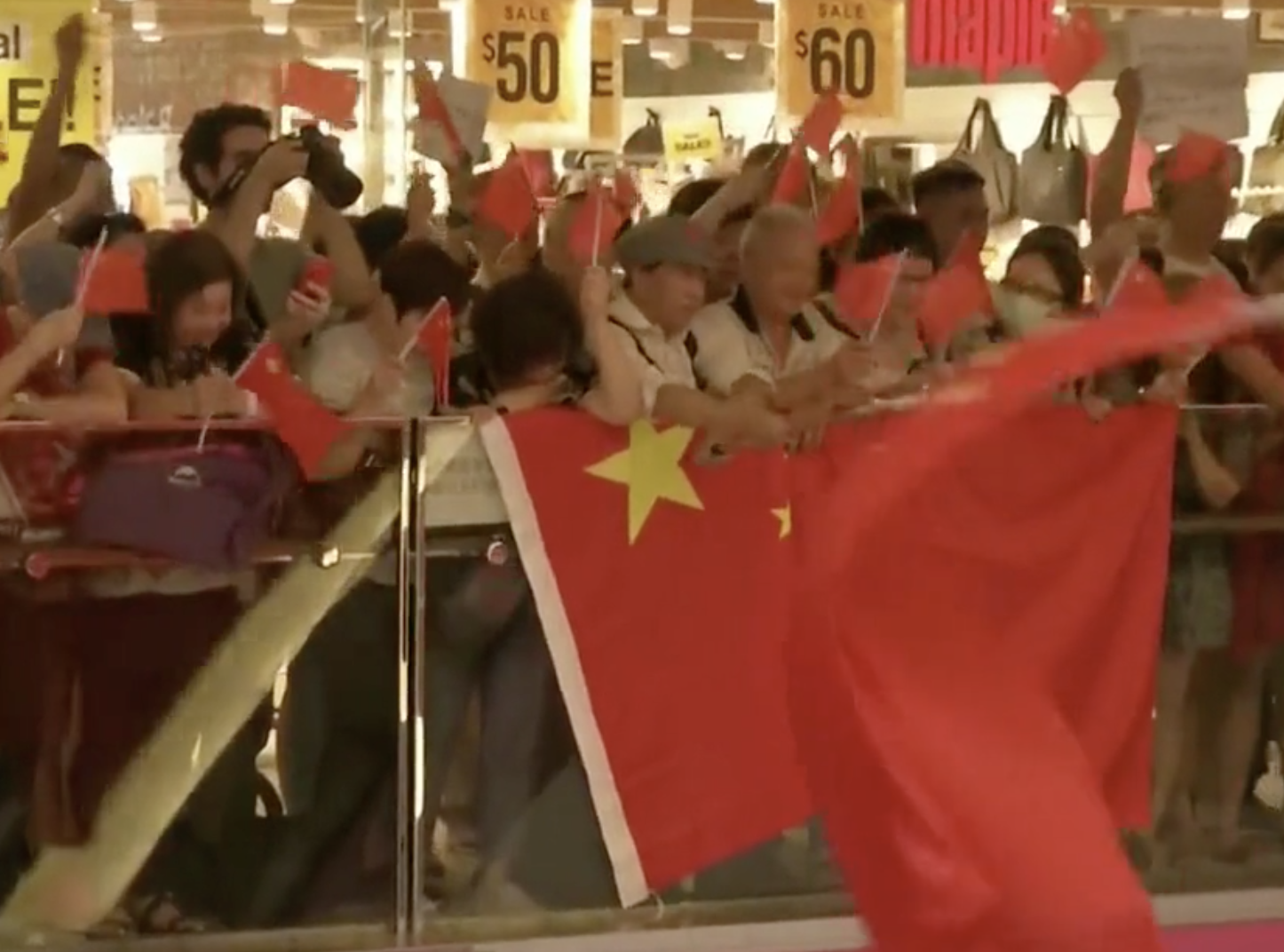 Hundreds gather at Amoy plaza to sing Chinese national anthem and wave ...