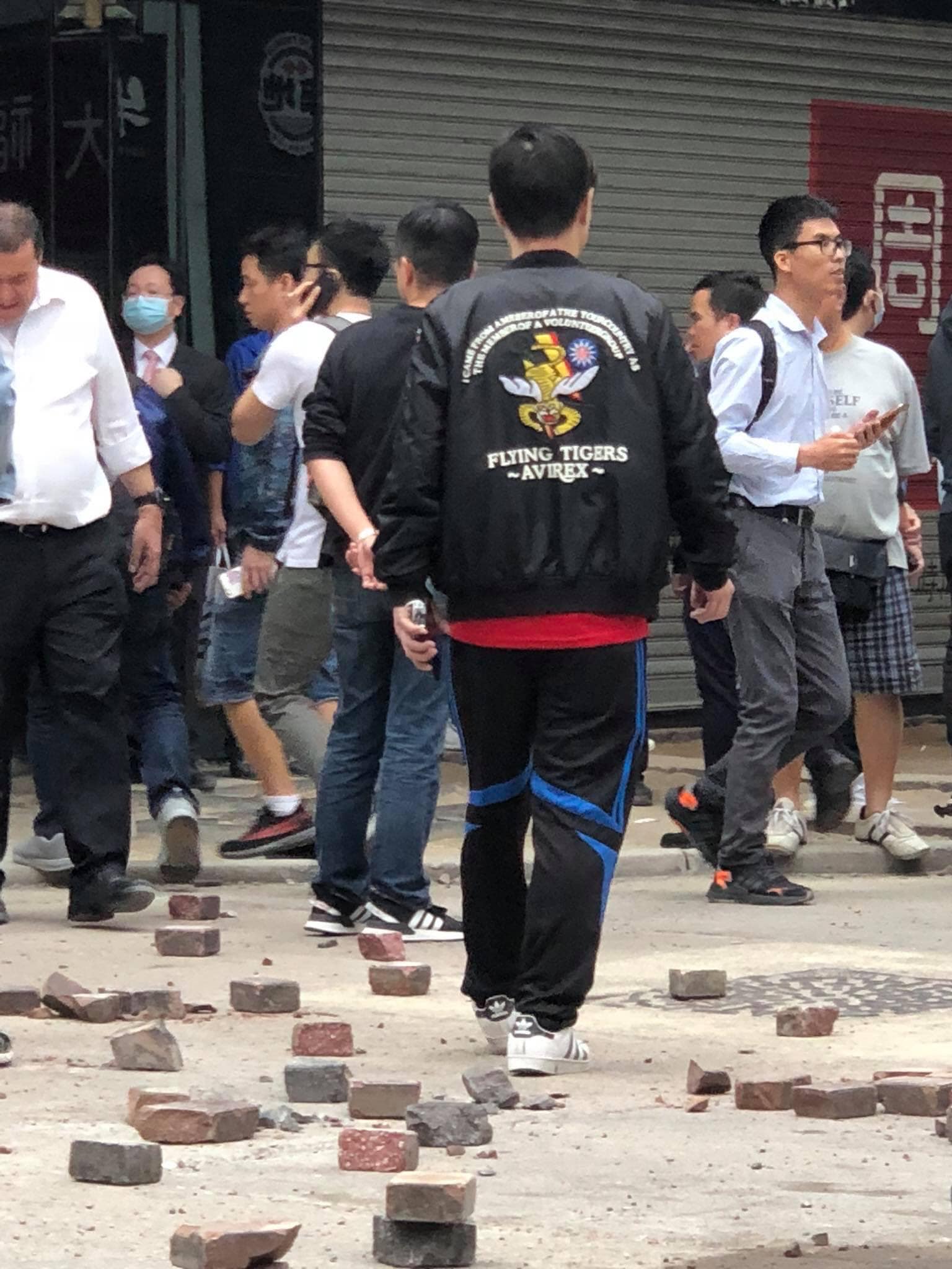 Protesters barricade roads in Mong Kok again, 2 alleged triad members ...