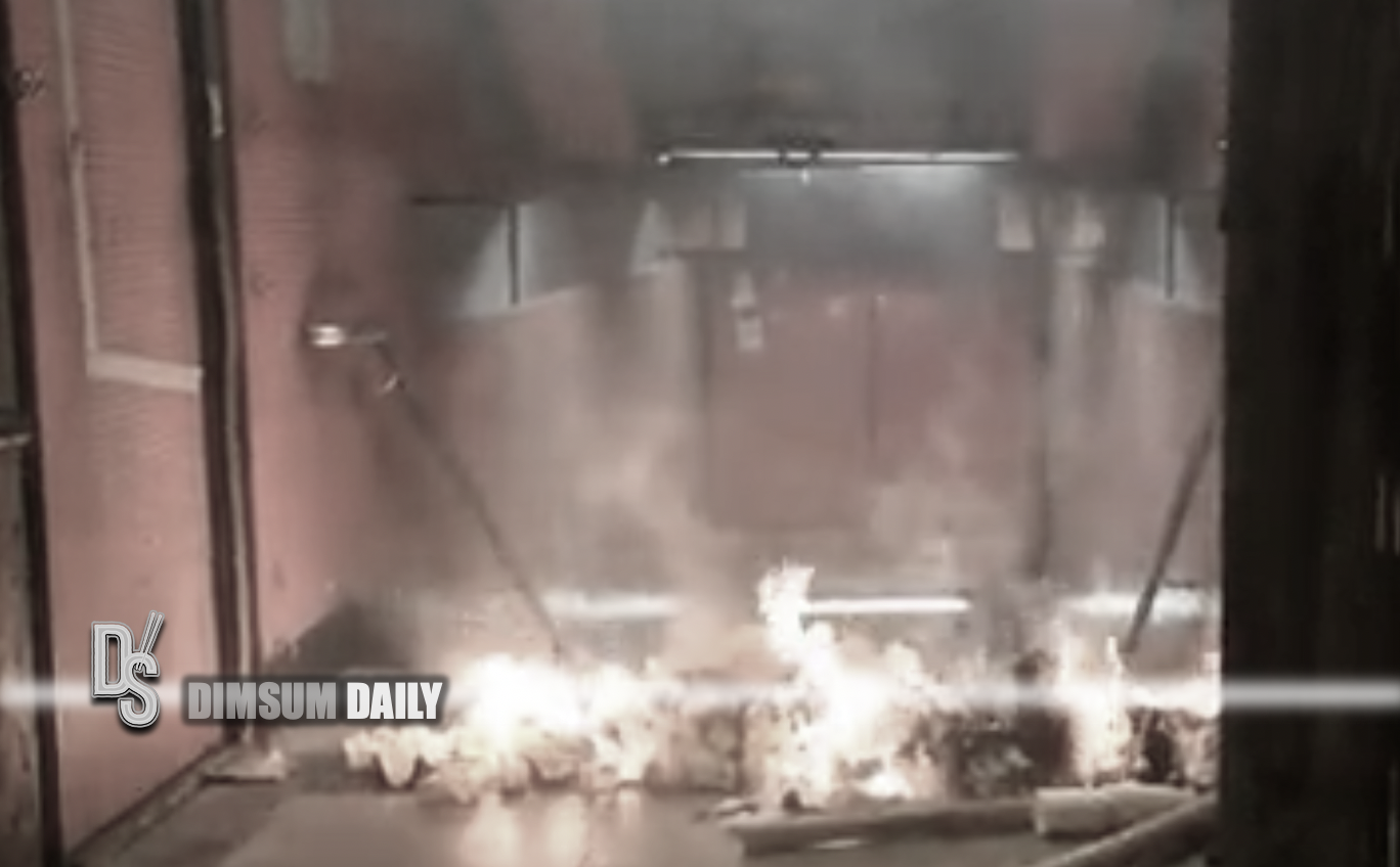 Rioters barricade roads and set fire to exit at Mong Kok MTR Station ...