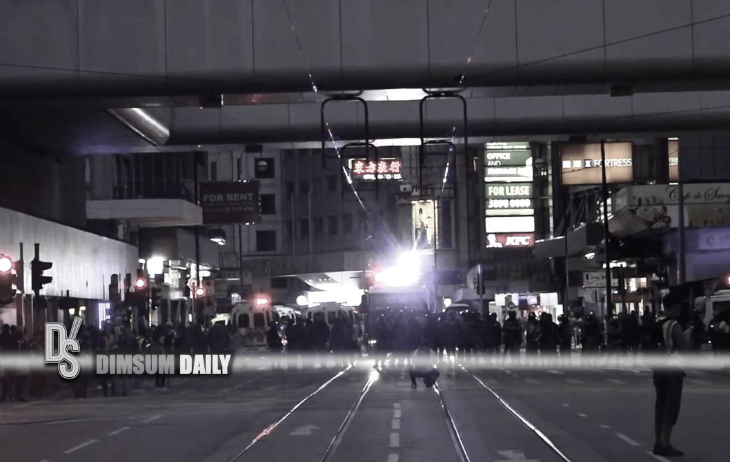 Frontline radicals and riot police in standoff on Des Voeux Road in ...