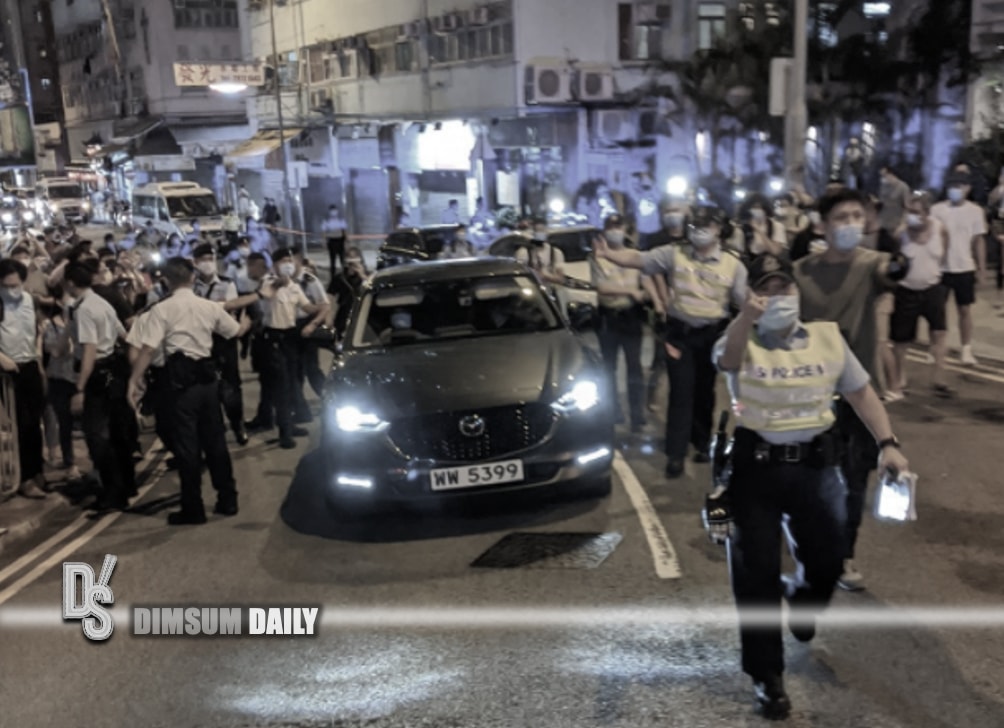 Pro-democracy Legislative Councillor Ted Hui followed by a car with 2 ...