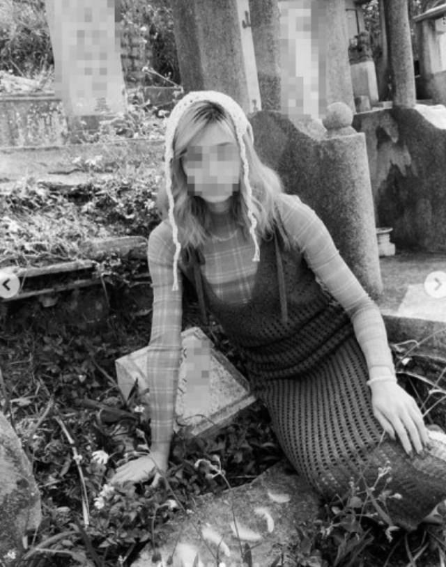 Photographer takes pictures of model posing in front of tombstones at ...