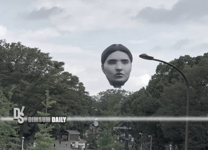 Giant floating head floats above Yoyogi Park in Tokyo - Dimsum Daily