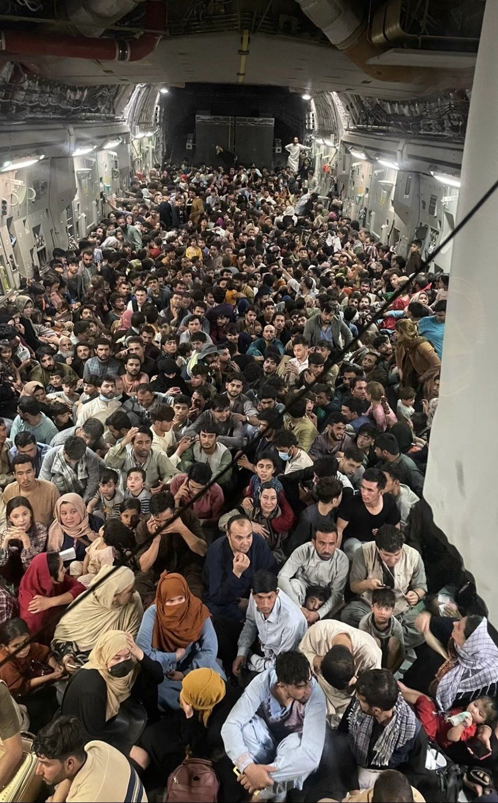 Striking image on U.S. military cargo plane captures Kabul exodus ...