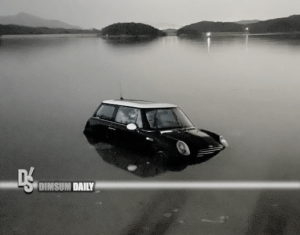 Mini Cooper submerged in sea water on beach in Sai Kung - Dimsum Daily