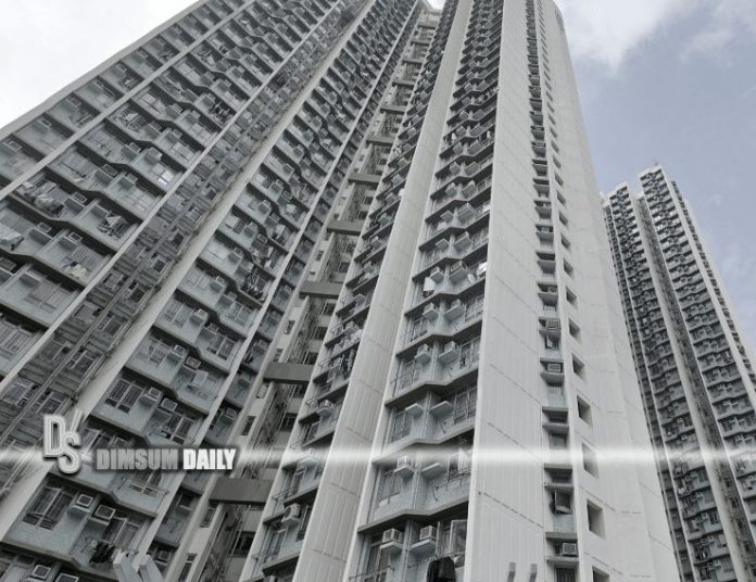 66-year-old woman sits precariously at apartment window in Kai Ting ...