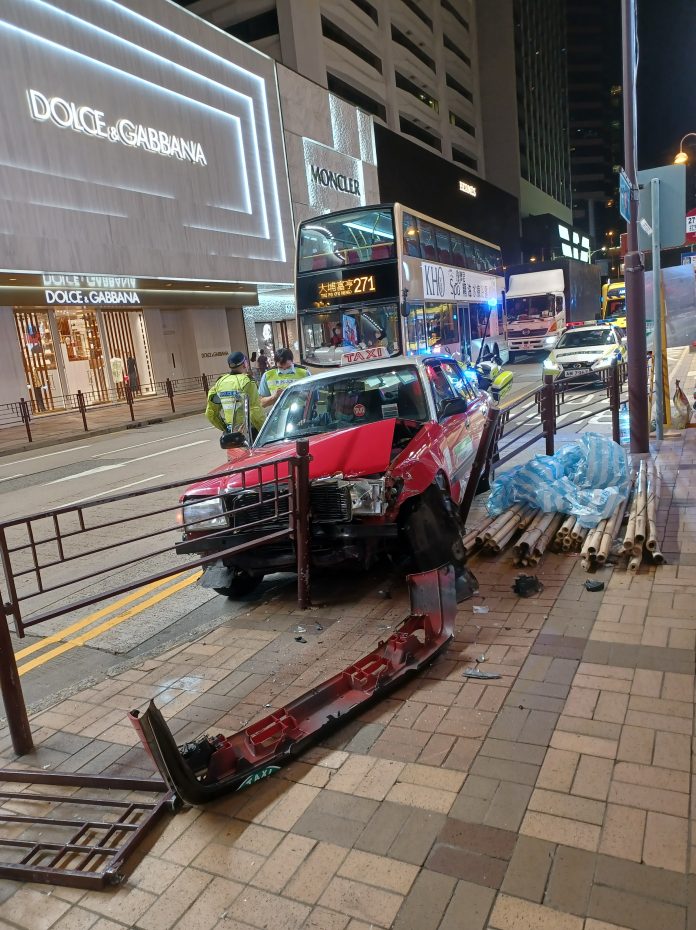 Taxi crashes into traffic railing on Canton Road in TST - Dimsum Daily