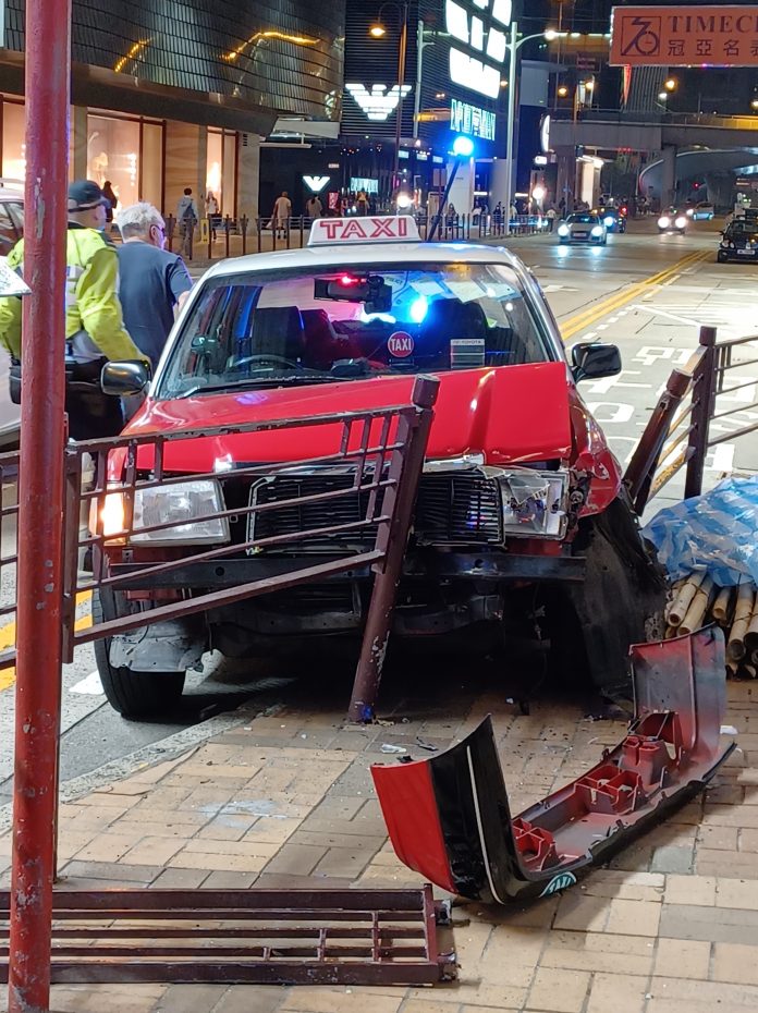 Taxi crashes into traffic railing on Canton Road in TST - Dimsum Daily