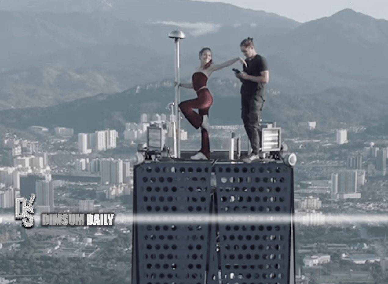 Russian daredevil couple who scales 2nd tallest building in Malaysia ...