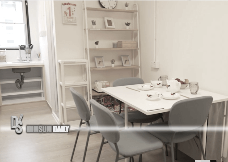 Secretary for Housing shows a group of subdivided unit tenants to a ...