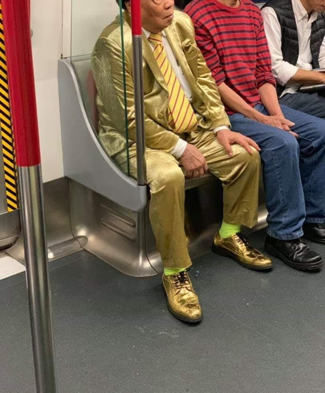 Pictures of 2 men in gold outfits travelling on MTR trains go viral on ...