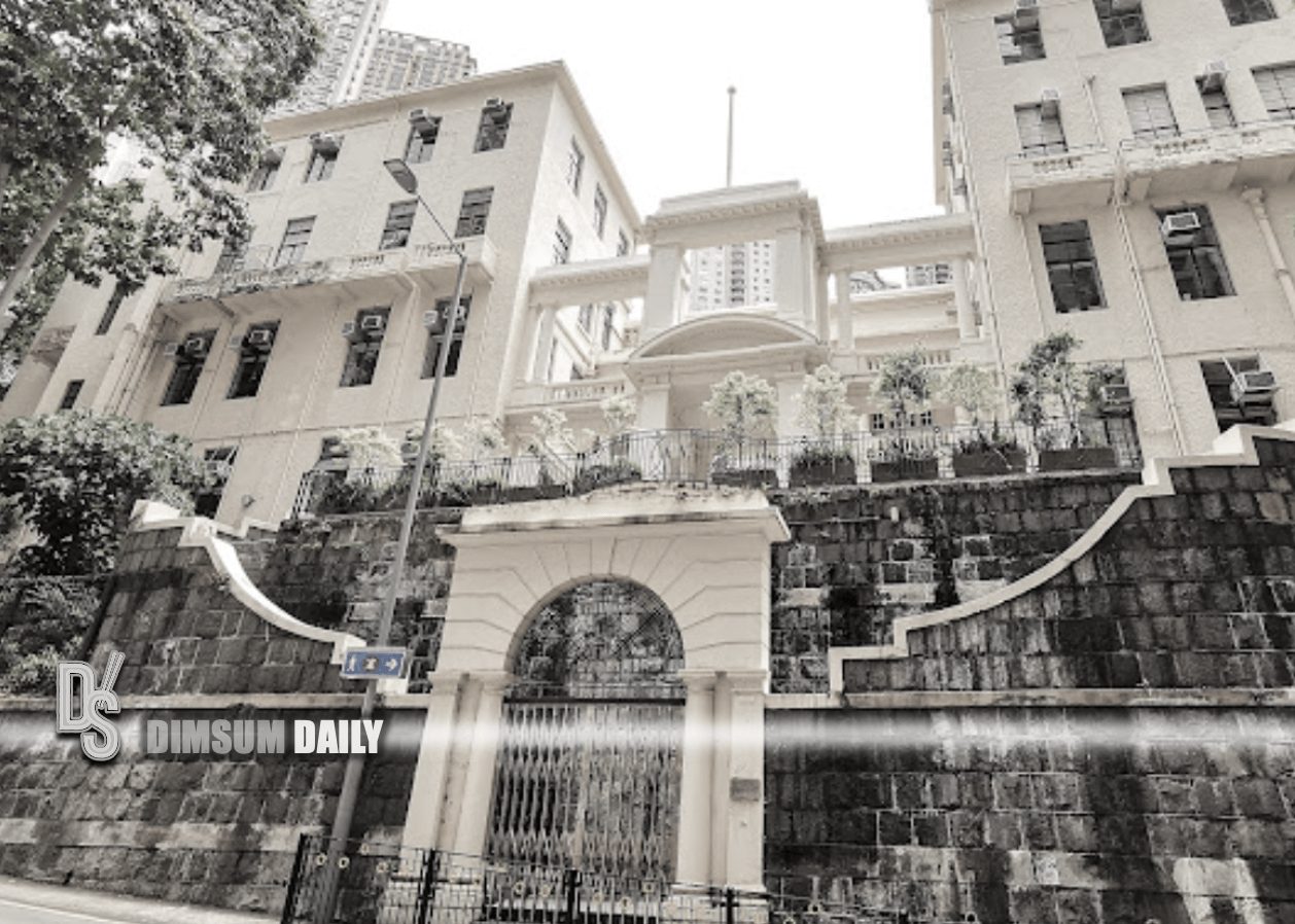 Female student sits precariously on windowsill of toilet located on 3rd floor of St. Stephen's ...
