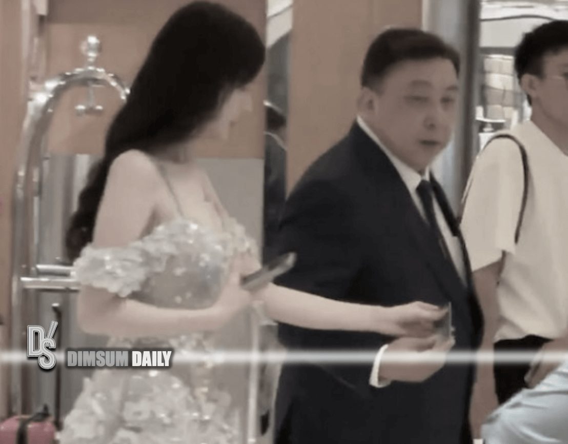 Hong Kong movie director Wong Jing spotted receiving hotel key card from actress Qianqian Yun ...