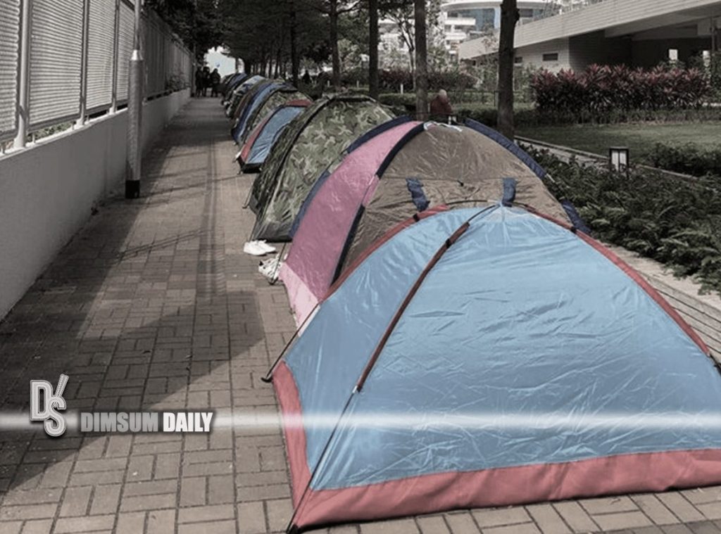 Foreign domestic helpers reserve spots, stay overnight in tents on ...