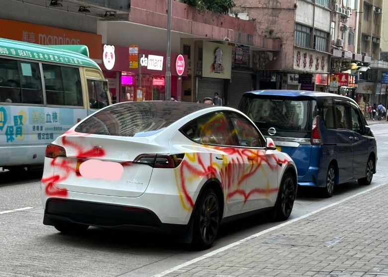 Tesla car vandalised with graffiti on Queen's Road West - Dimsum Daily