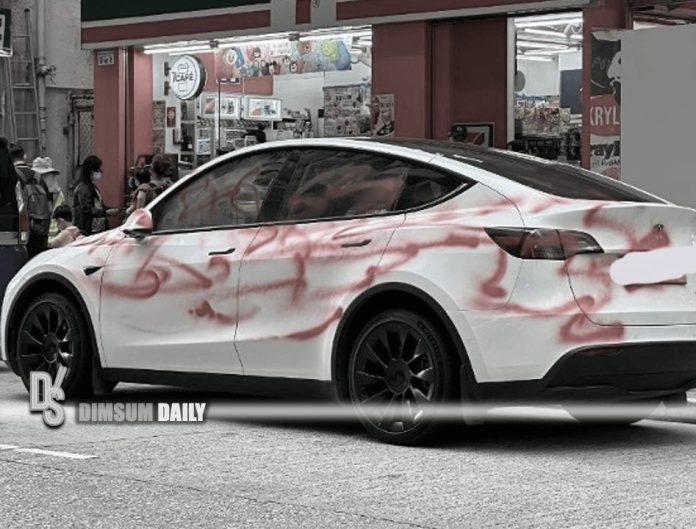 Tesla car vandalised with graffiti on Queen's Road West - Dimsum Daily