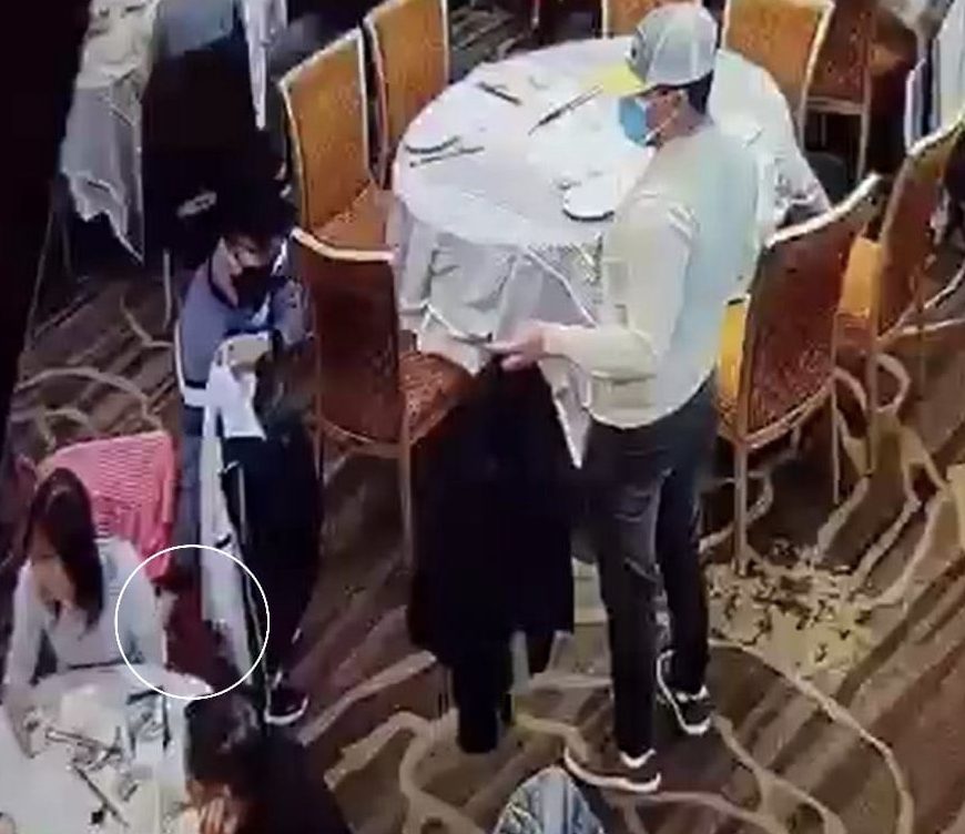 Two male thieves collaborate in restaurant theft, using distracting ...