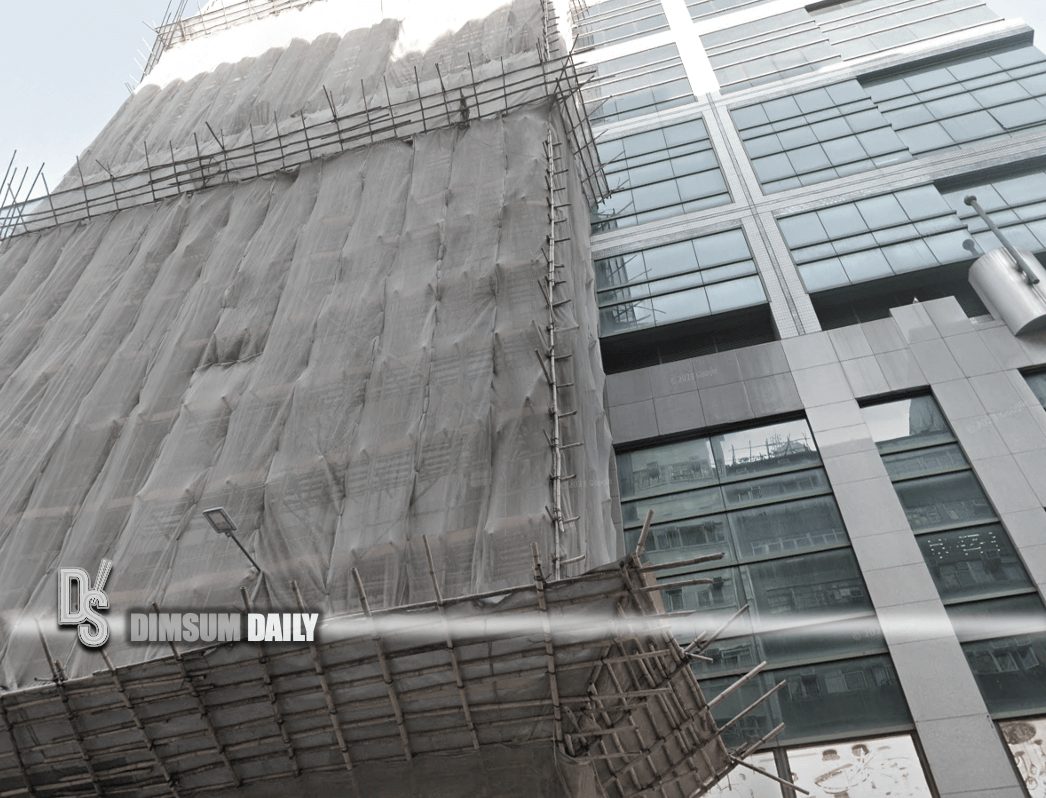 Man climbs building's AC unit on scaffolding in Mong Kok before being ...