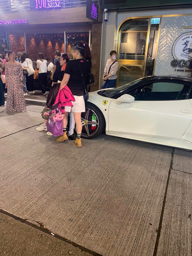Netizens outraged as white Ferrari in Mong Kok gets crowded by middle ...