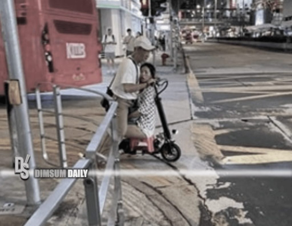Viral photo of elderly man pushing electric scooter with female ...