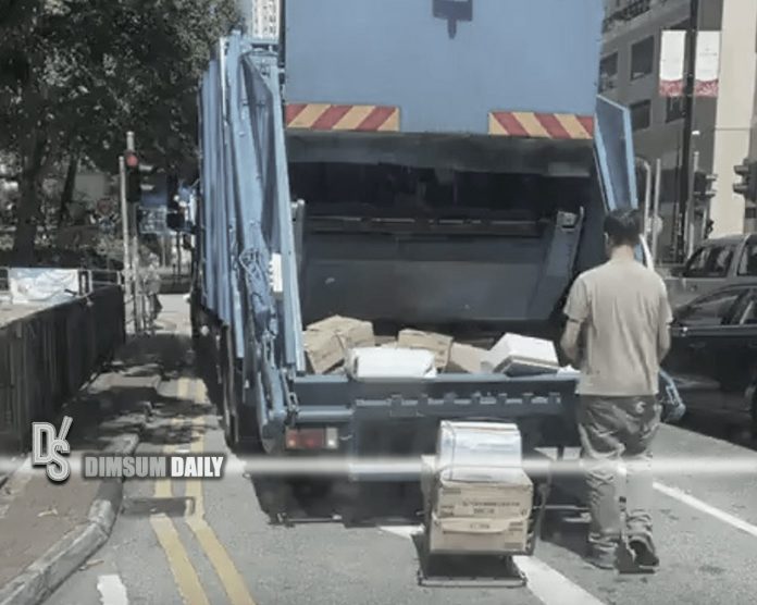 Mystery surrounds short video of worker unloading boxes into the hopper ...