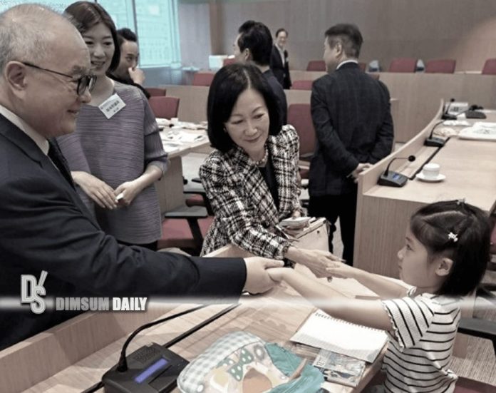 Lawmaker Eunice Yung's daughter draws during Hang Seng University event ...