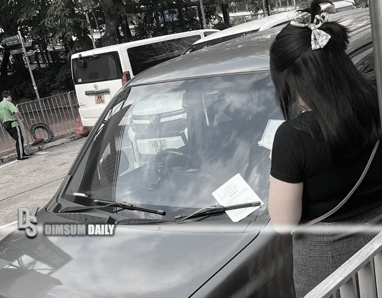 Housing Department staff issue traffic summonses at Lai Kok Estate in Sham Shui Po, sparking ...