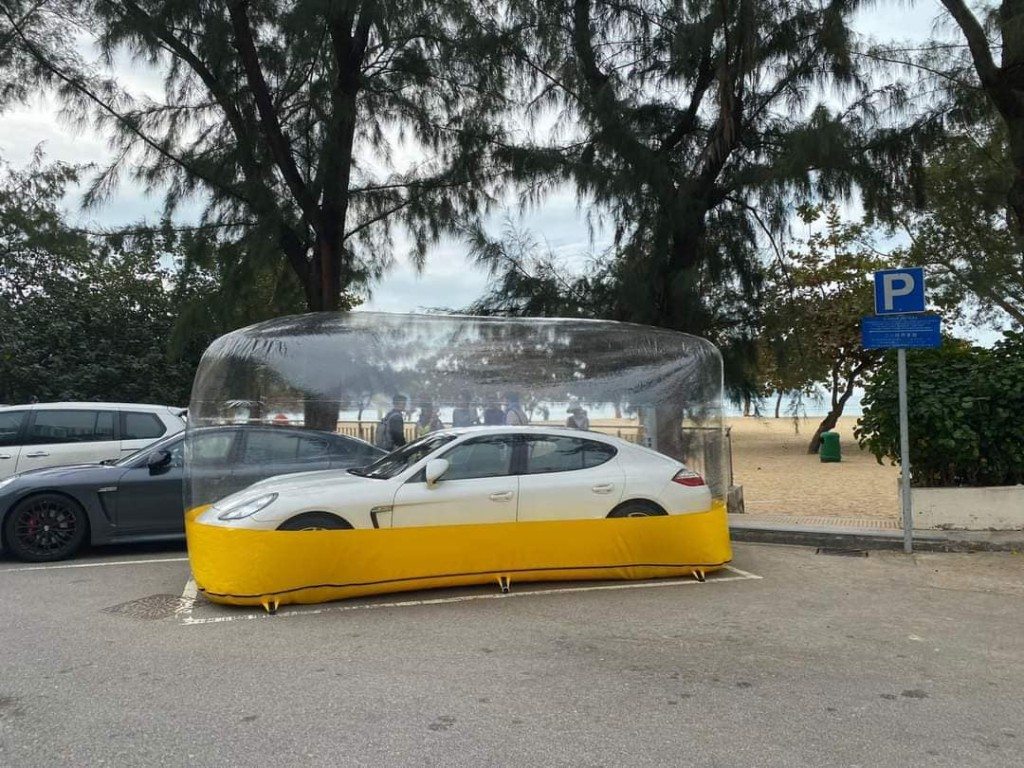 Porsche shielded by inflatable cover thwarts parking enforcement in ...
