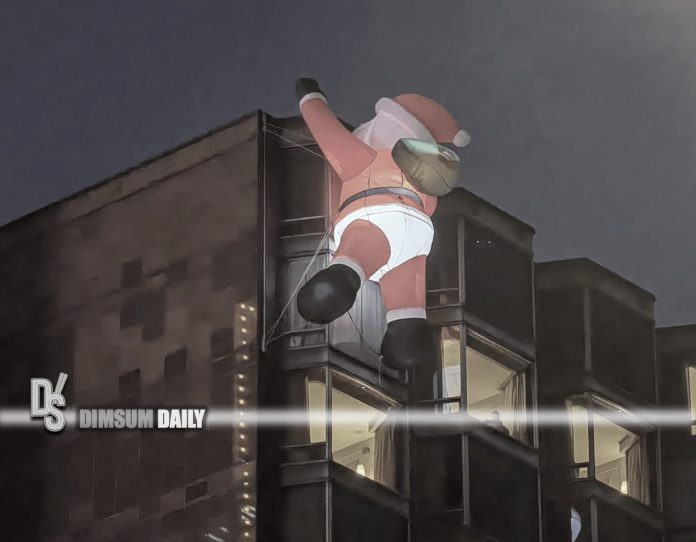 Inflatable climbing Santa Claus spotted at Kowloon Shangri-La, netizens ...