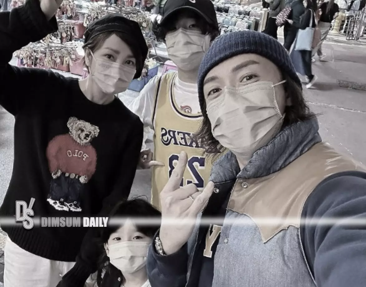 Hong Kong singer Kay Tse and husband Louis Cheung enjoy a perfect Sunday stroll in Mong Kok with ...