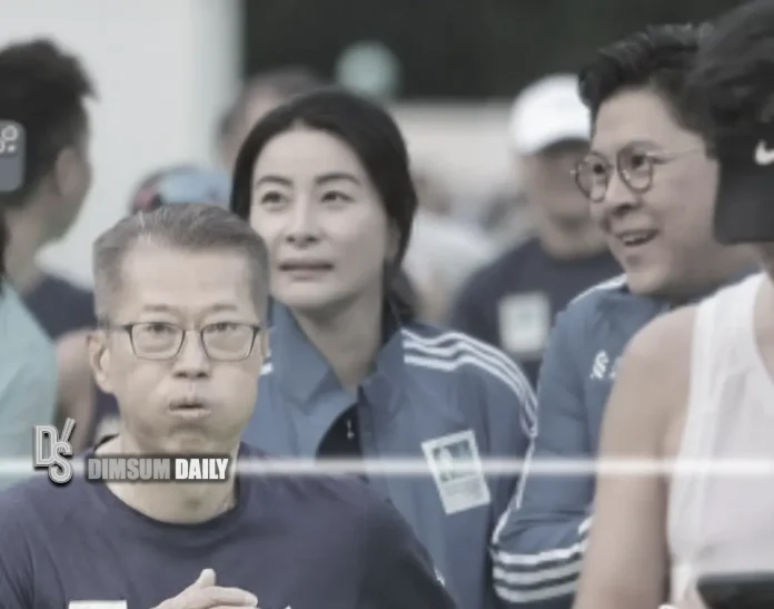 Financial Secretary Paul Chan, LegCo member Kenneth Fok and wife cross ...