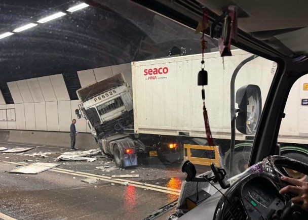 Container truck crash in Cheung Tsing Tunnel triggers water main break ...