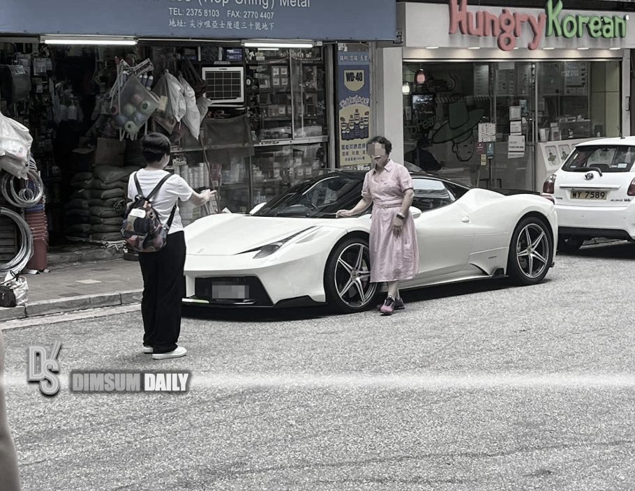 Four middle-aged women surround Ferrari in Tsim Sha Tsui - Dimsum Daily