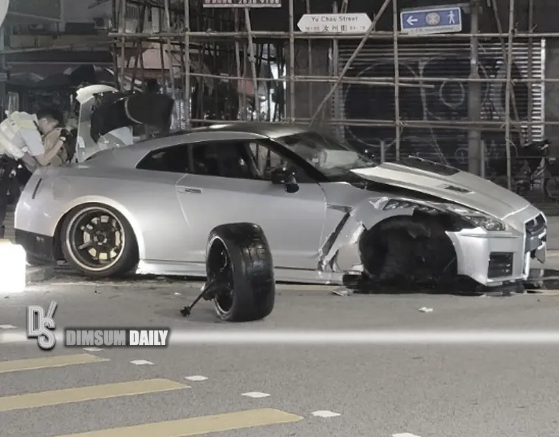 Nissan GT-R sports car crashes into traffic signal and signboard in ...