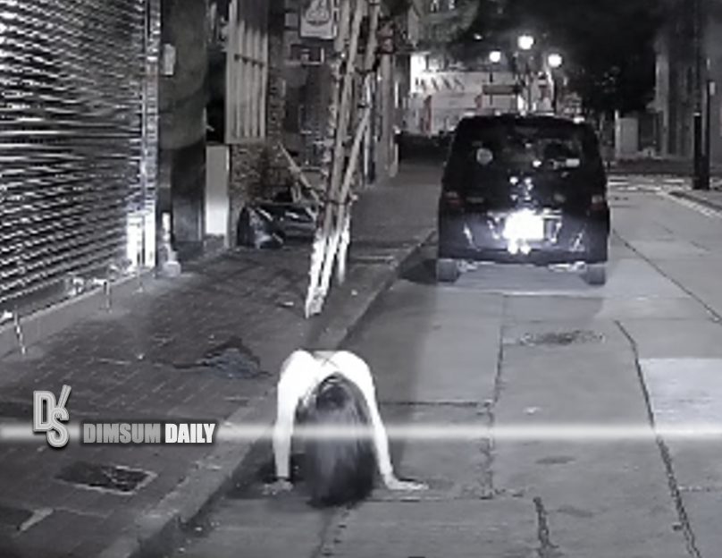 Intoxicated woman crawling on Hong Kong street goes viral, draws horror ...