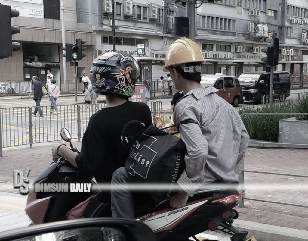 Pillion rider in Hong Kong seen wearing construction helmet instead of ...