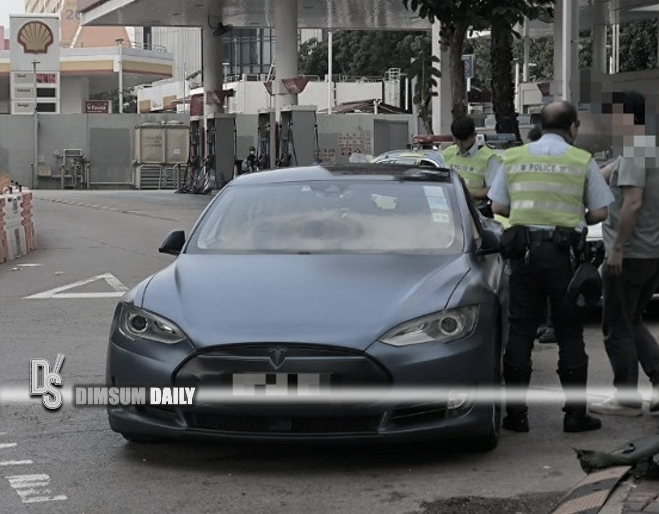 55-year-old man arrested for driving Tesla without licence in Kowloon Bay