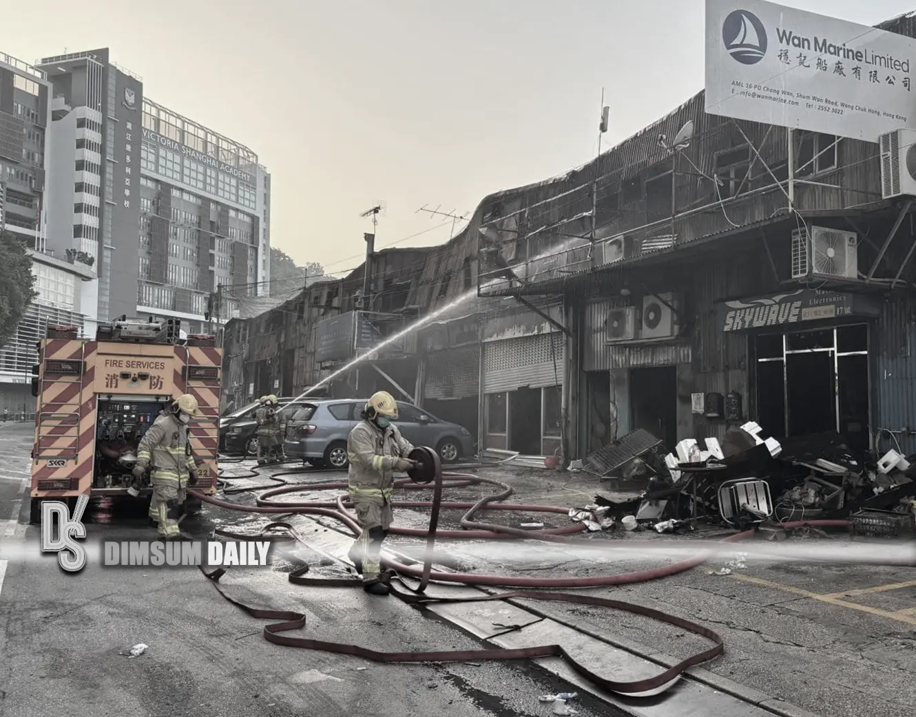 Firefighters continue to cool the Shum Wan Road shipyard after a severe ...