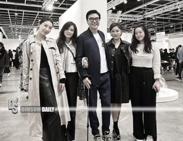 Veteran singer and actor Kenny Bee spotted in Central with wife and daughter