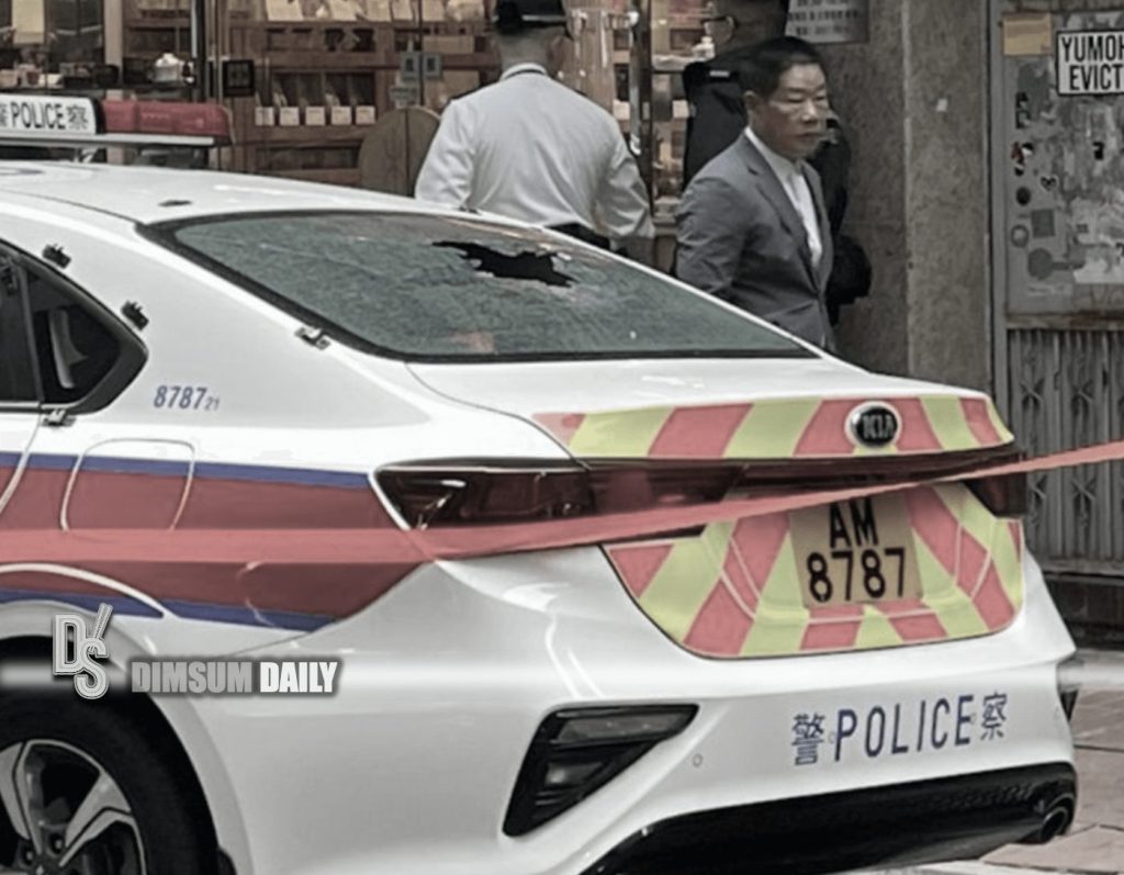 Falling bottle shatters police car window in Sheung Wan