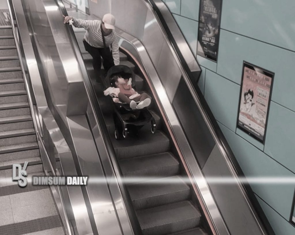 Foreign domestic helper takes escalator with child in stroller at MTR ...