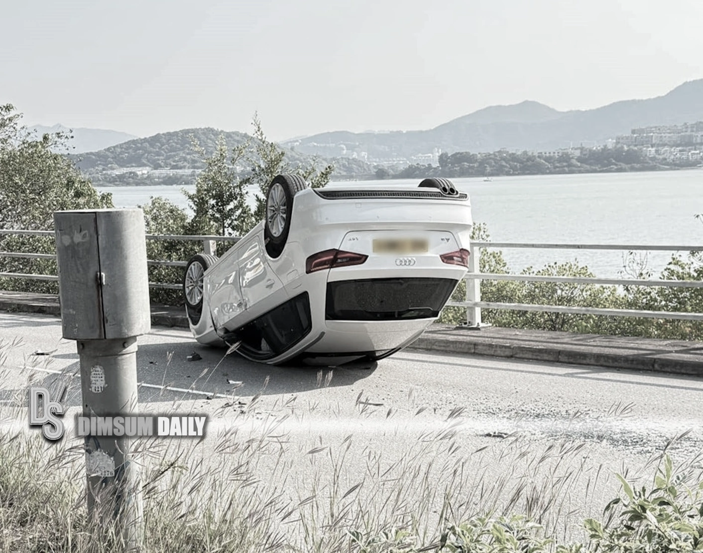 Tai Po car crash leaves driver unharmed after vehicle flips