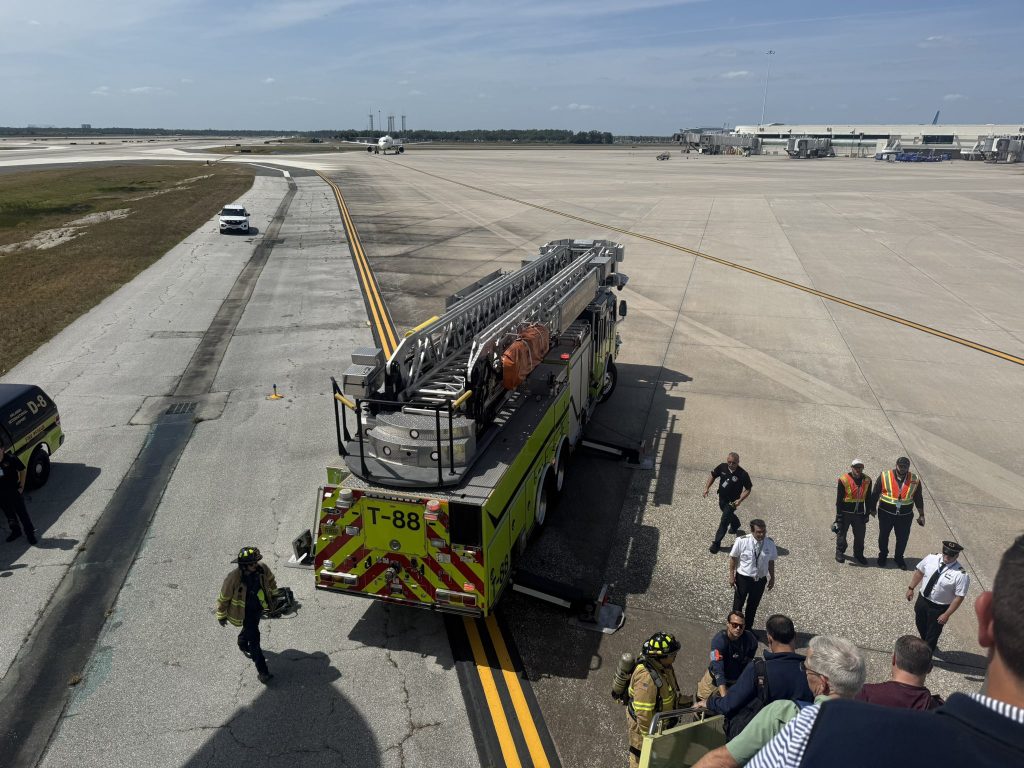 Nearly 300 passengers evacuated after Delta plane engine catches fire ...